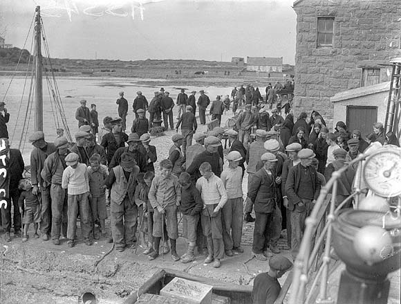 Holdings: [Crowd of islanders at the quayside, Kilronan, Aran Islands]